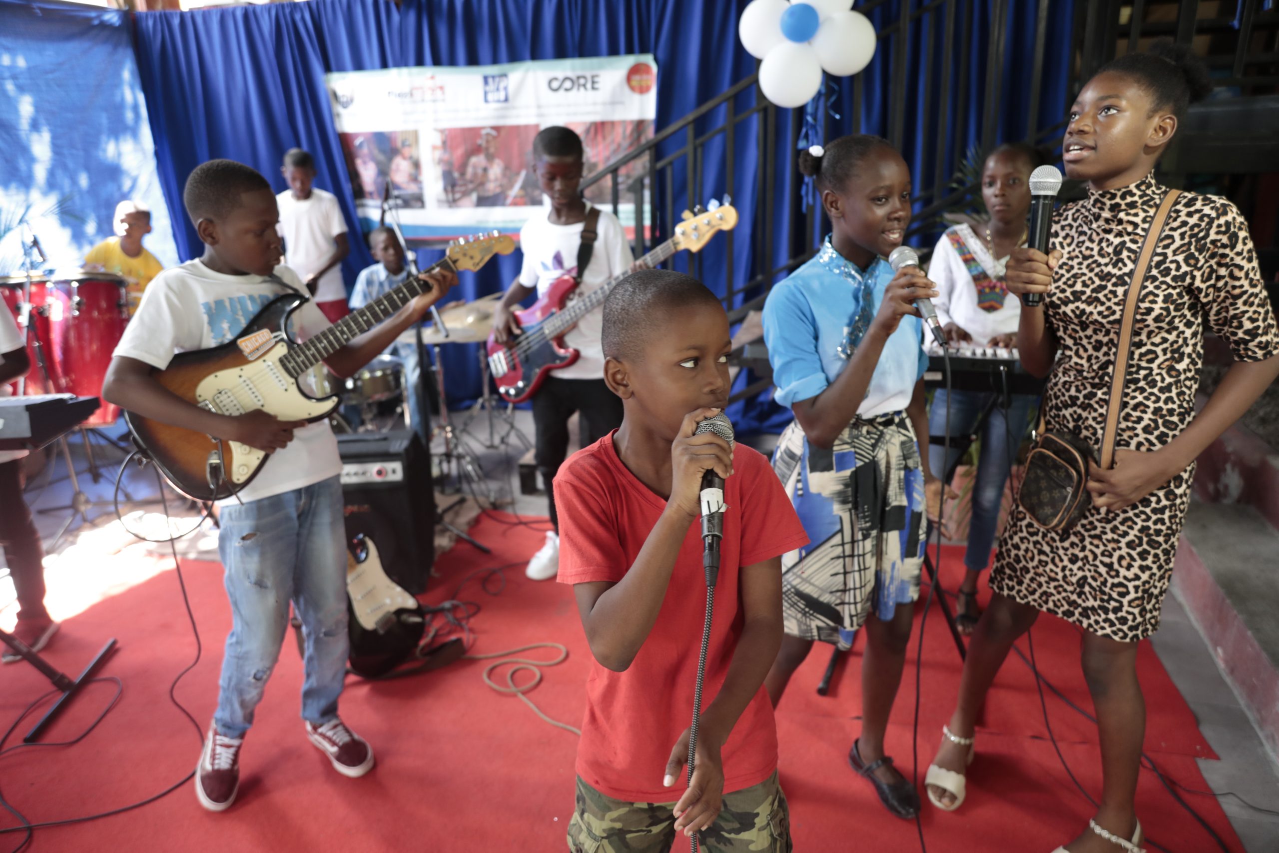 Haitian students play drums and strum guitars to escape hunger and gang ...